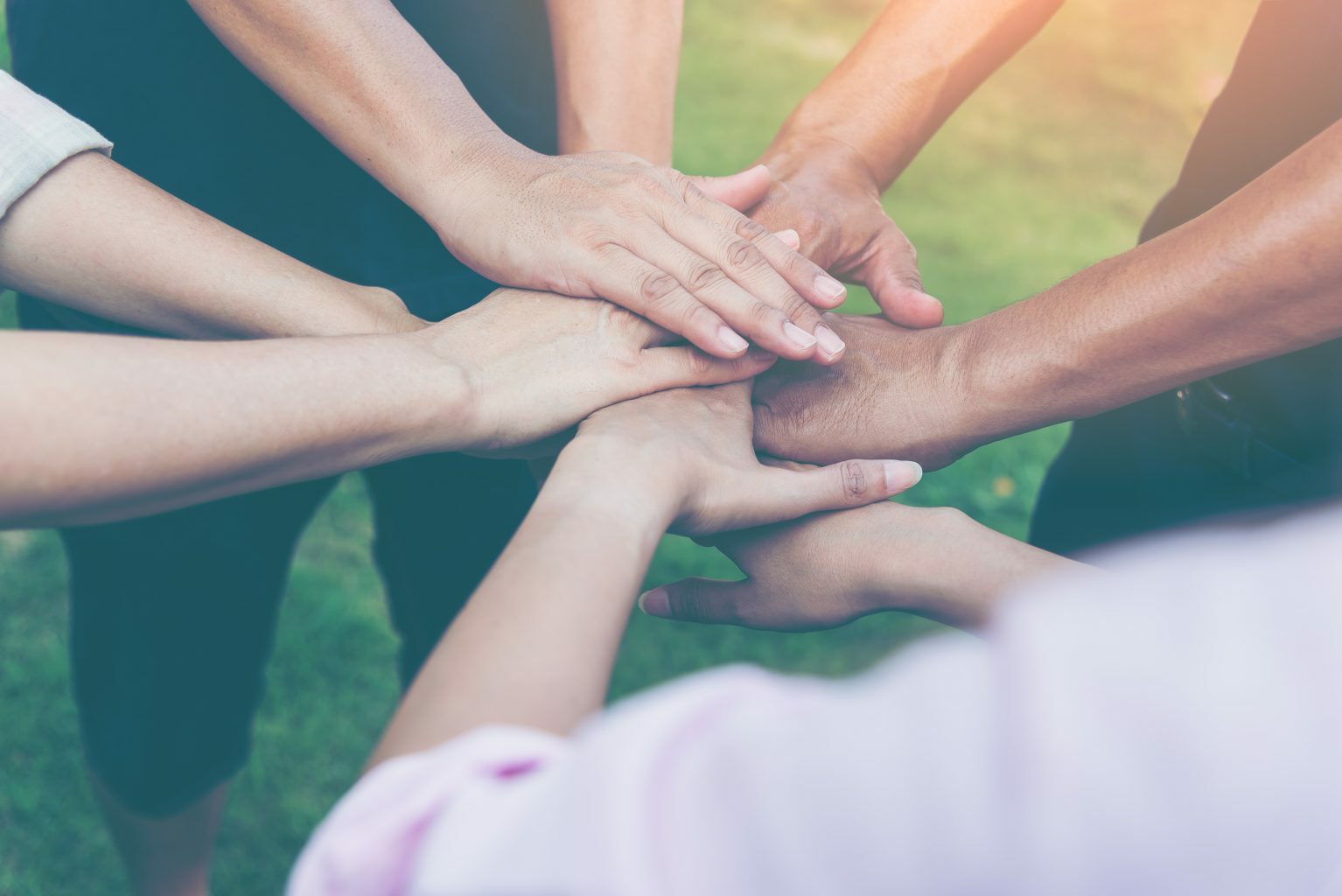 Closeup,Of,Stack,Of,Hands.,Colleague,Putting,Their,Hands,On - ABIMO